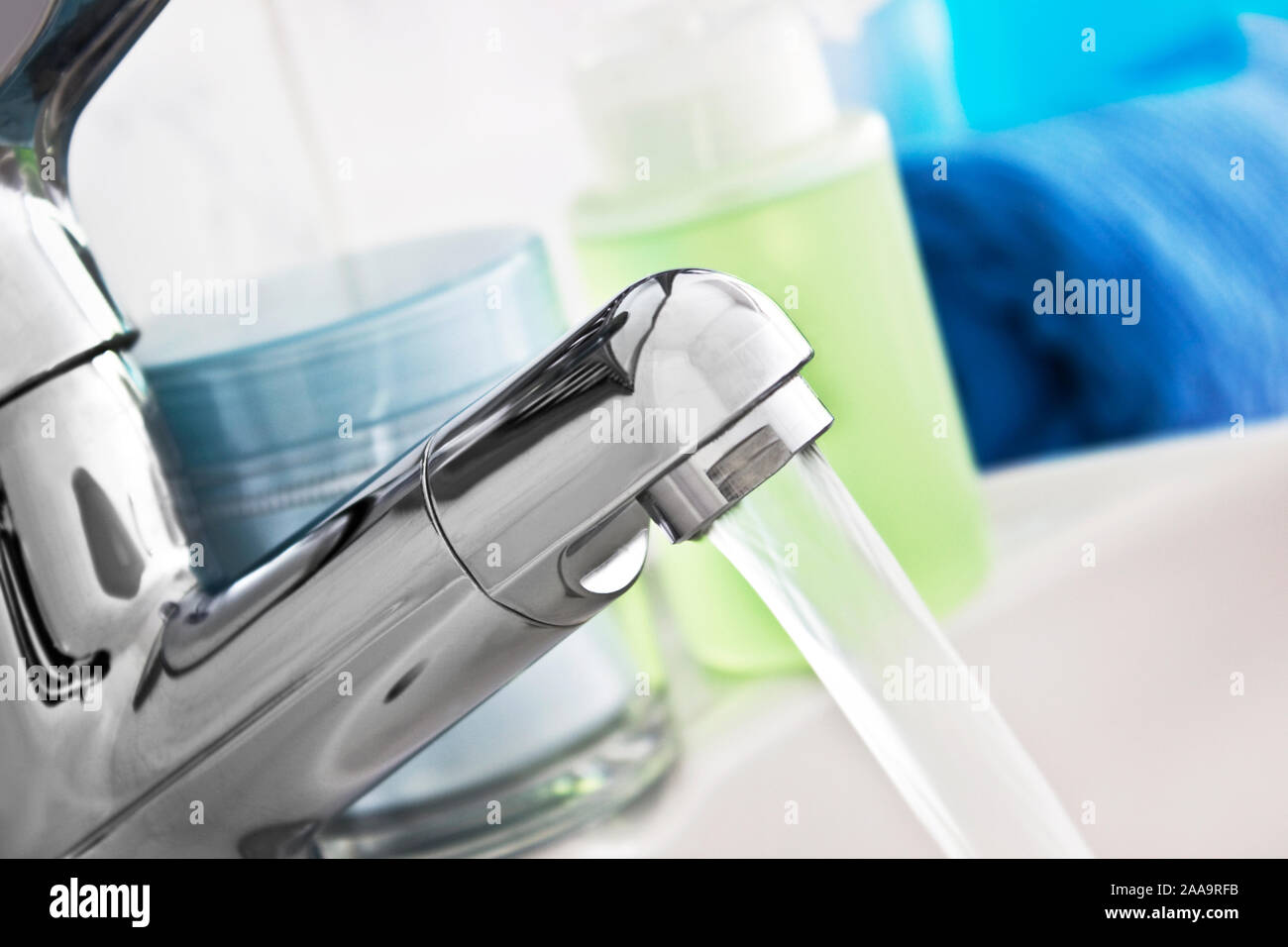 Water tap close up and blue background Stock Photo - Alamy