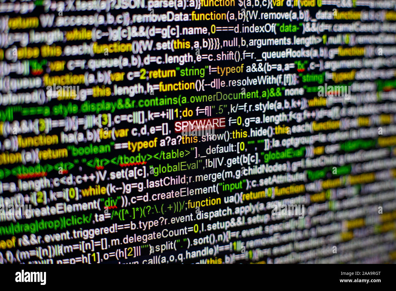Macro Photo Of Computer Screen With Program Source Code And Highlighted Spyware Inscription In