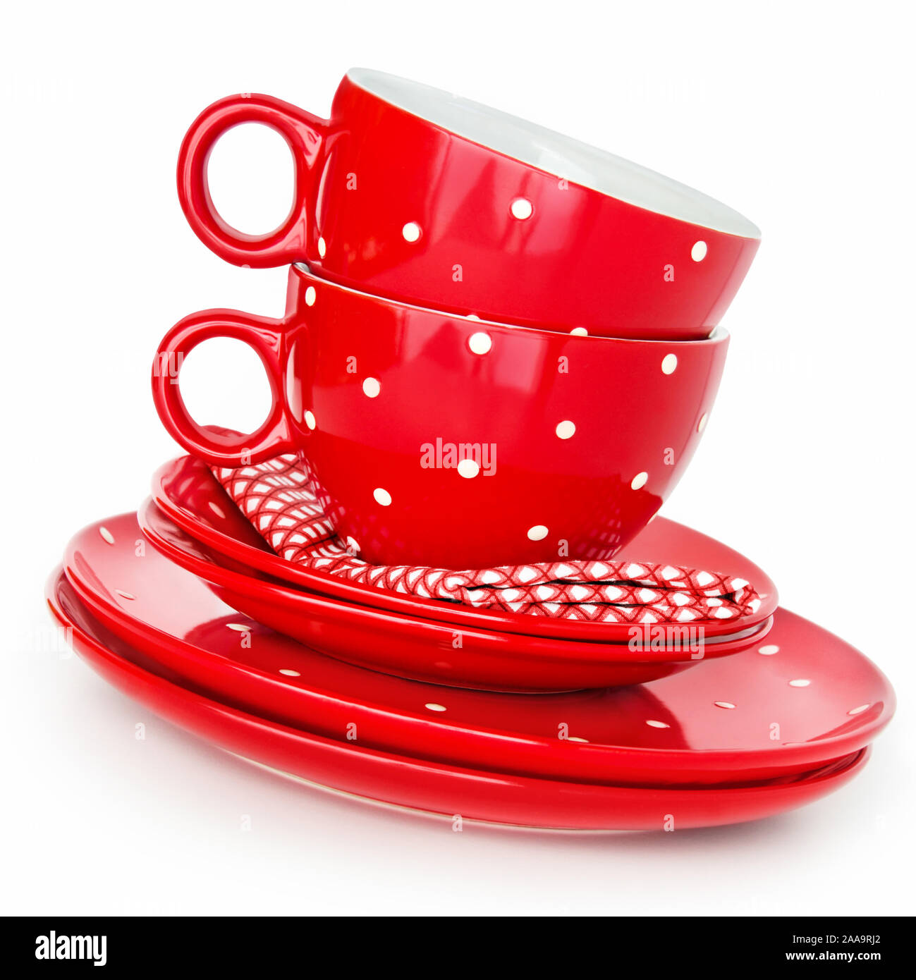 Set of dishes two red cups and plates Stock Photo - Alamy