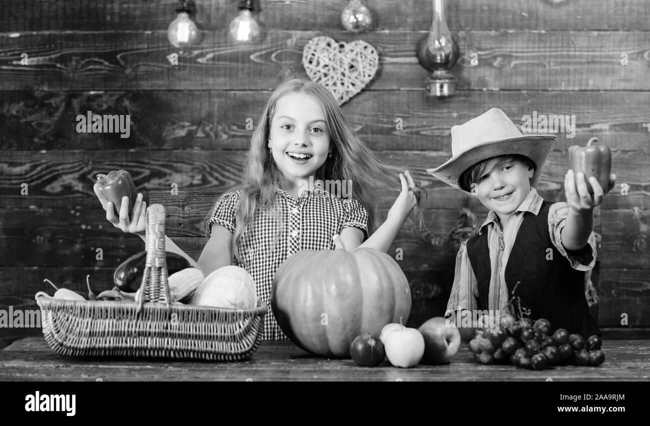 Family farm. Siblings having fun. Children presenting farm harvest ...