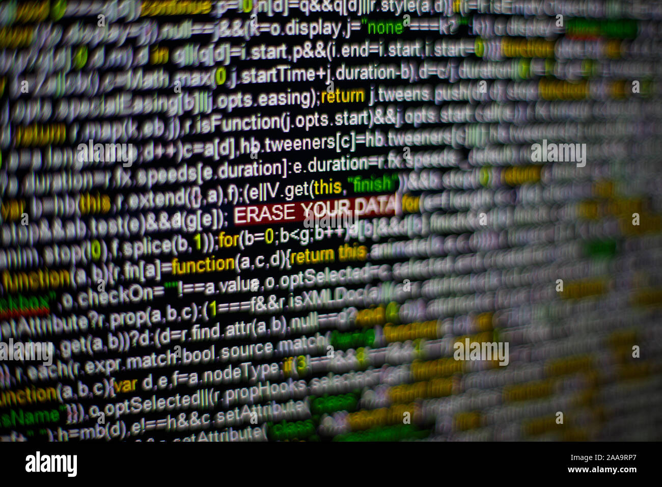 Macro photo of computer screen with program source code and highlighted ...