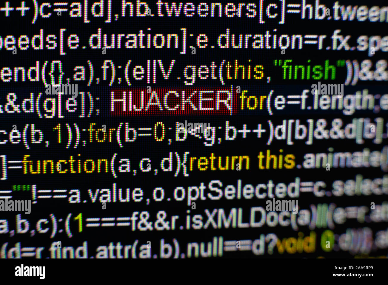 Macro photo of computer screen with program source code and highlighted HIJACKER inscription in ...