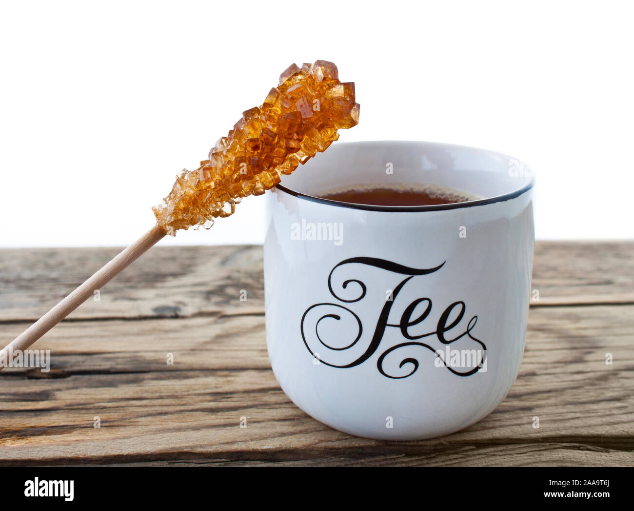 German: Tea and cream with candy Stock Photo - Alamy