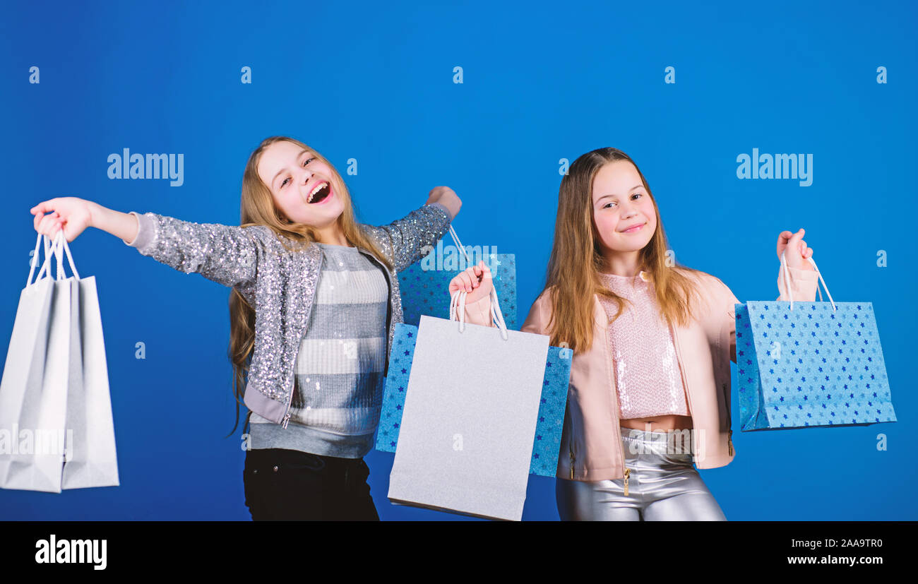 Happy children in shop with bags. Shopping is best therapy. Shopping ...