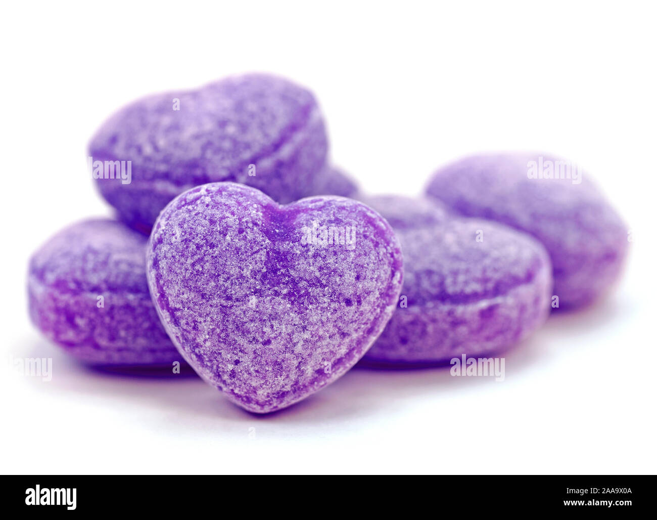 Heart shaped candies made from sugar in front of white background Stock ...