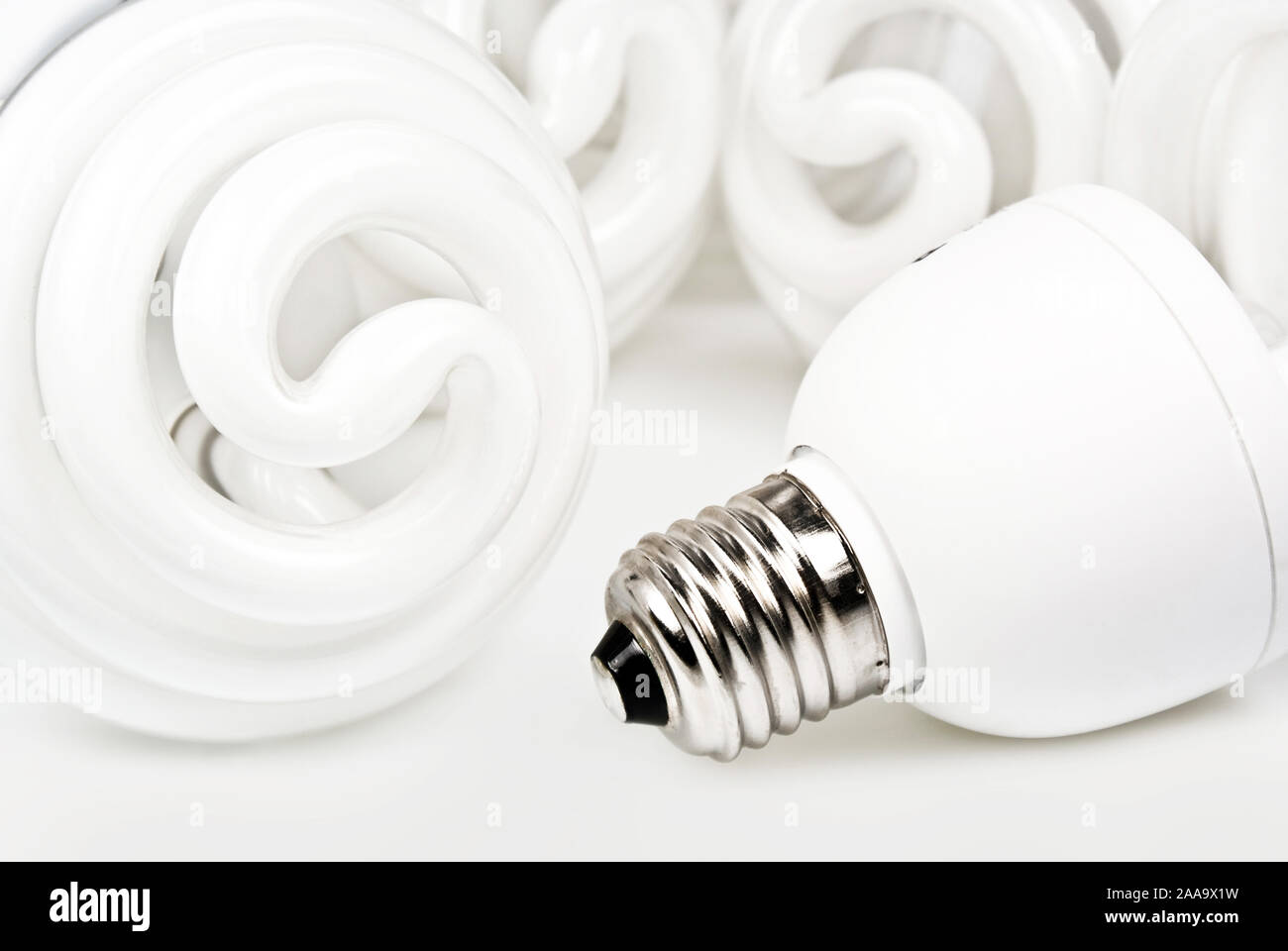 Energy saving lamps on white background Stock Photo - Alamy