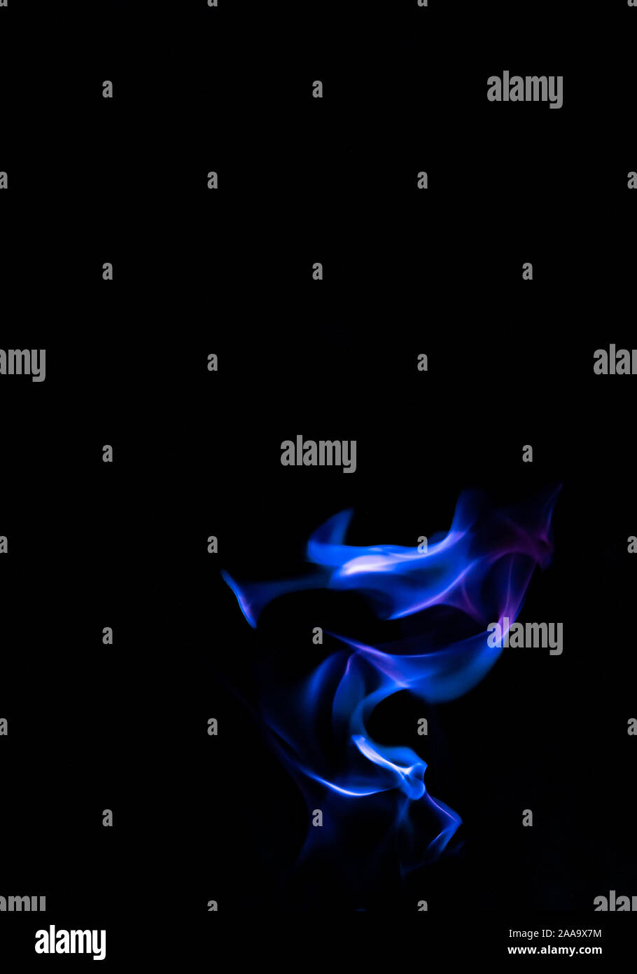 Blue fire forms abstraction in black background Stock Photo - Alamy