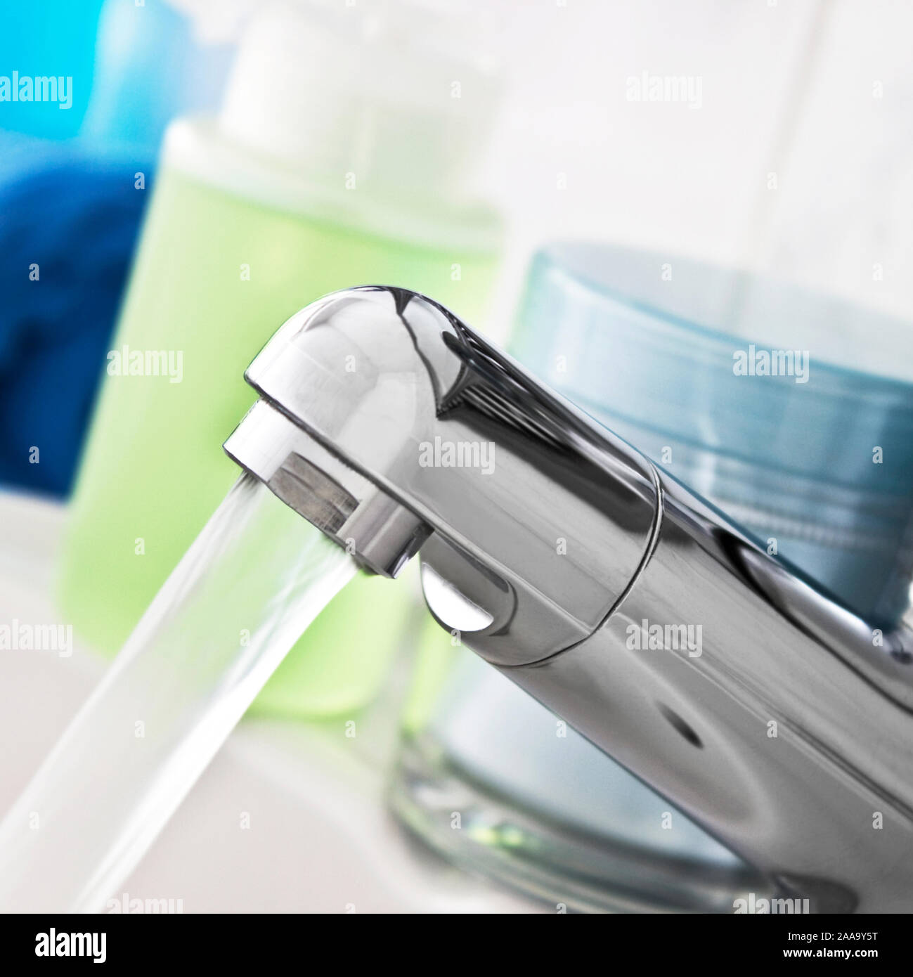 Water tap close up and blue background Stock Photo - Alamy