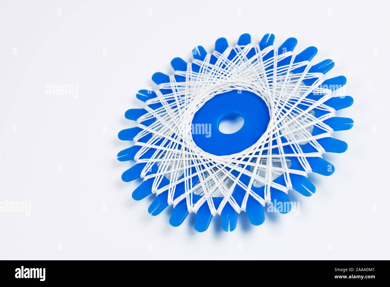 Sewing cotton close up on white background Stock Photo - Alamy