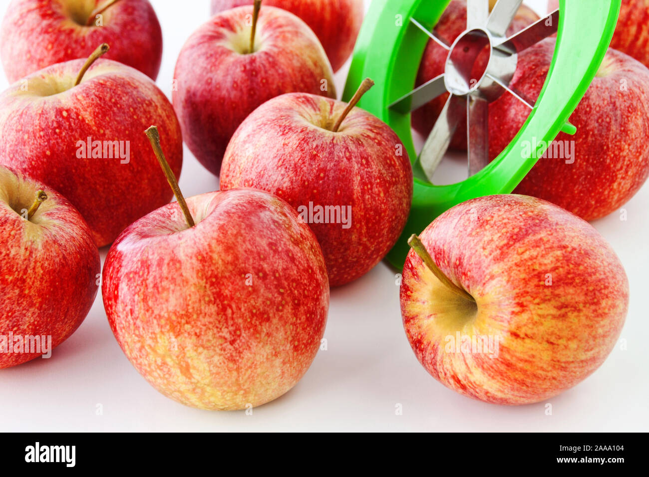 Red apples and slicer close up Stock Photo - Alamy