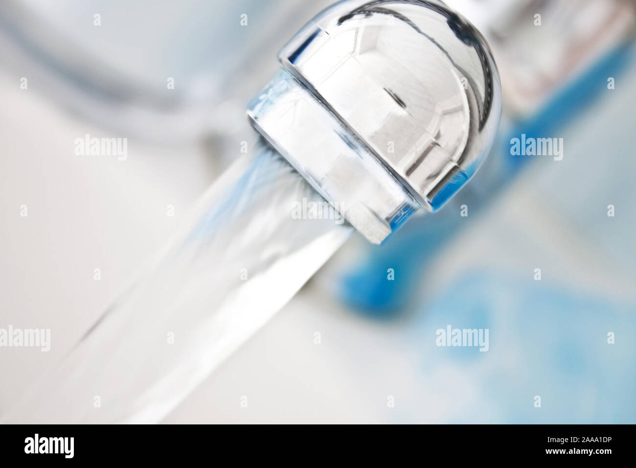Water tap close up and blue background Stock Photo - Alamy