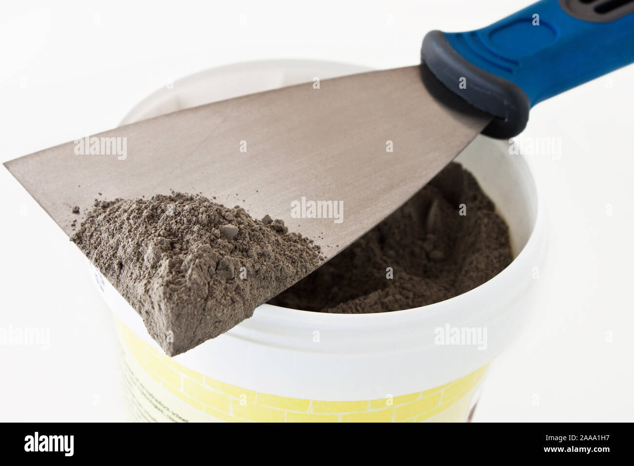 Handcraft cement and putty knife on white background Stock Photo - Alamy