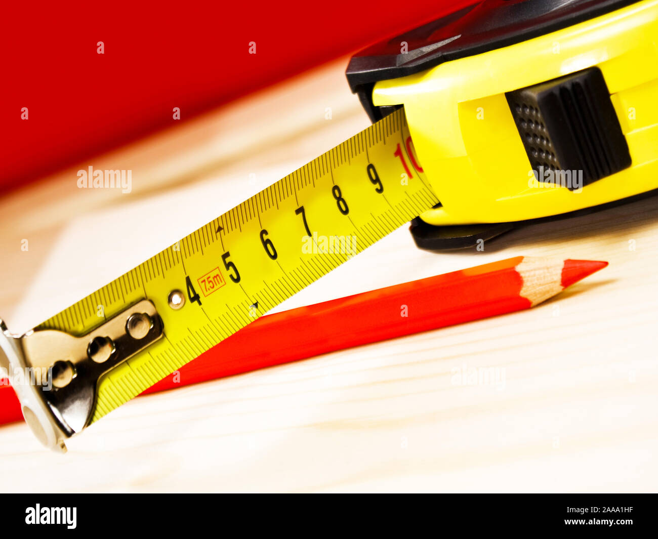 Measuring tape and red pencil Stock Photo - Alamy