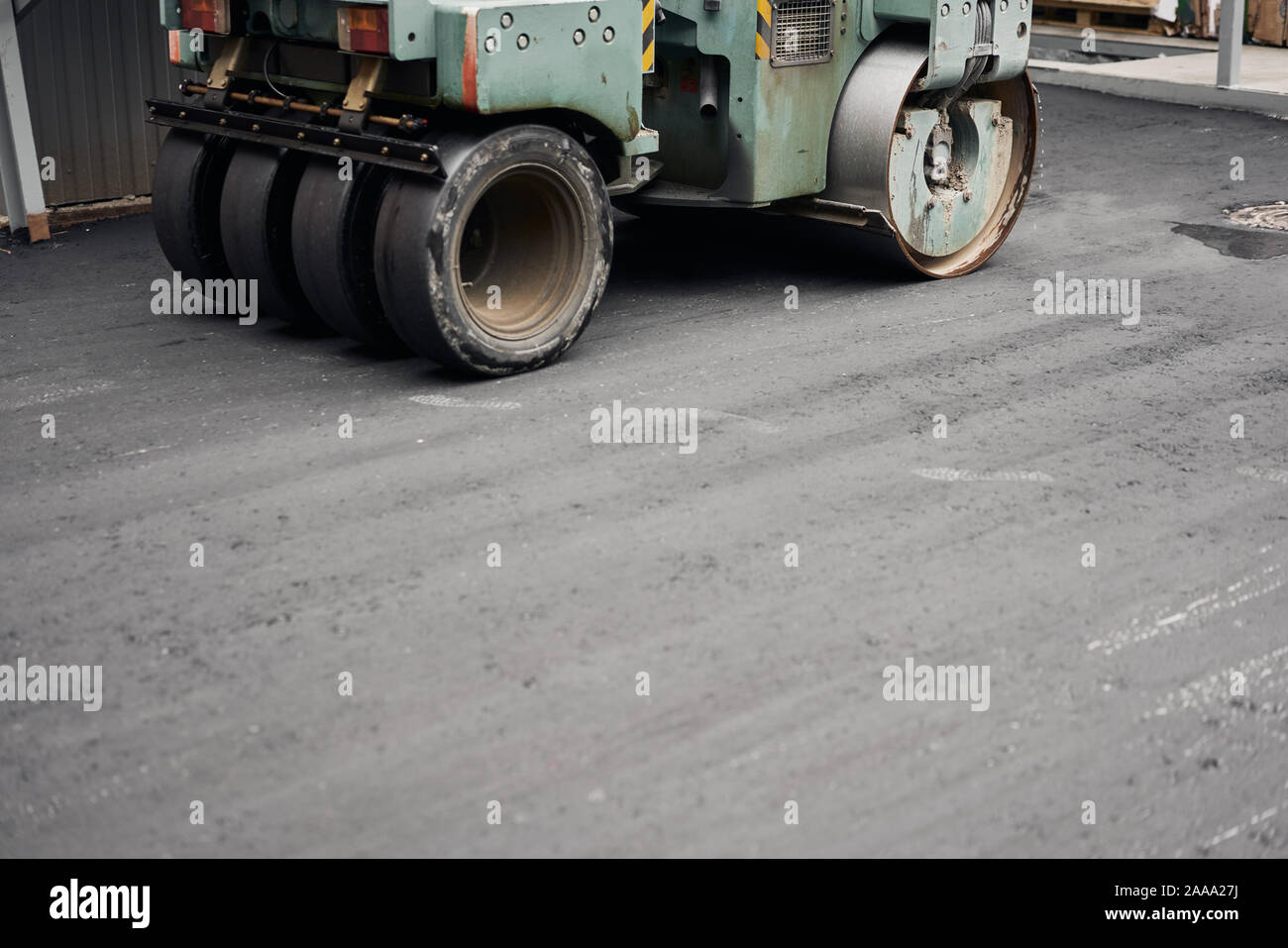 Asphalt Compactors is carrying out road repair work. Laying new asphalt ...