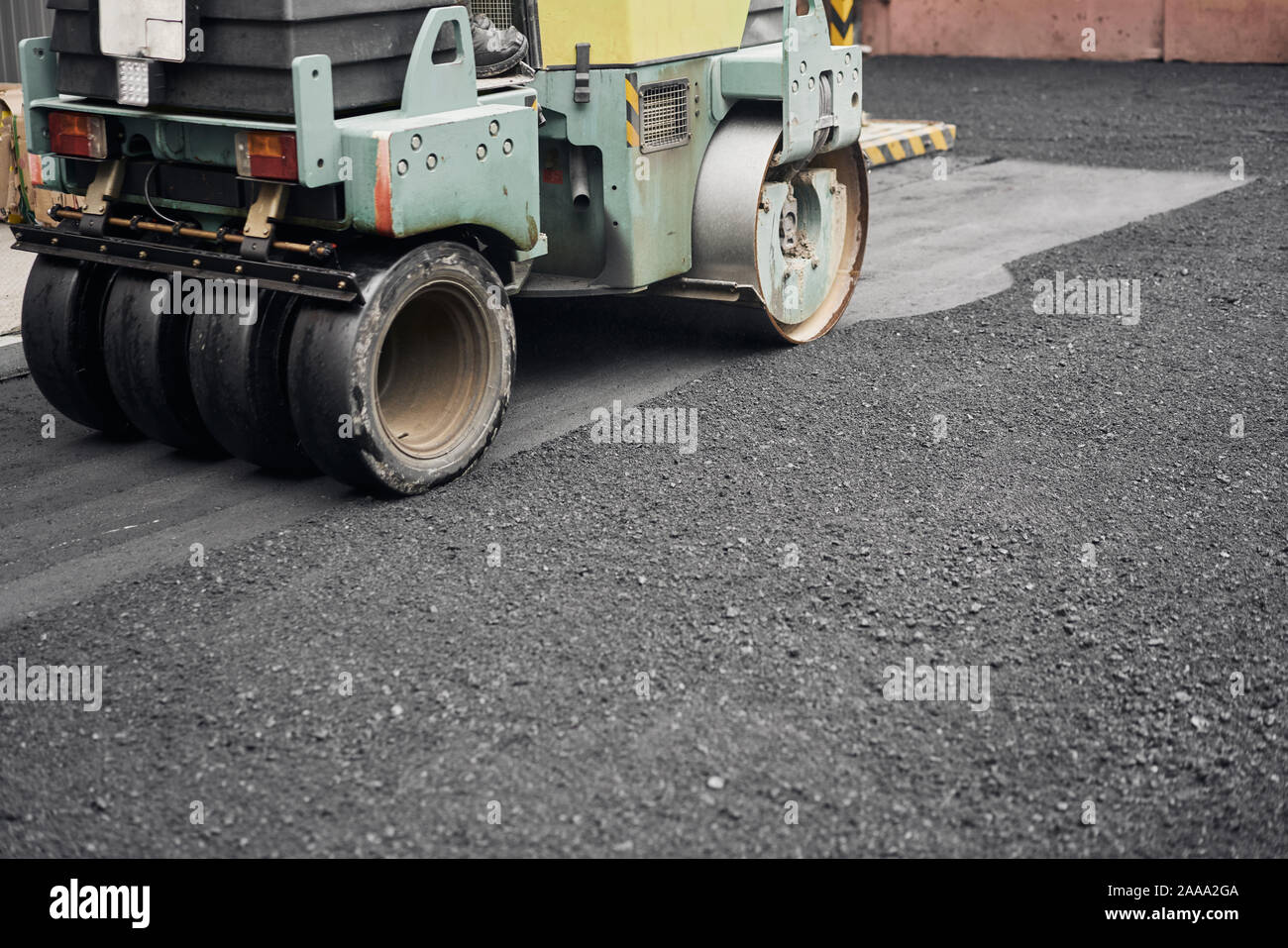 Asphalt Compactors is carrying out road repair work. Laying new asphalt ...