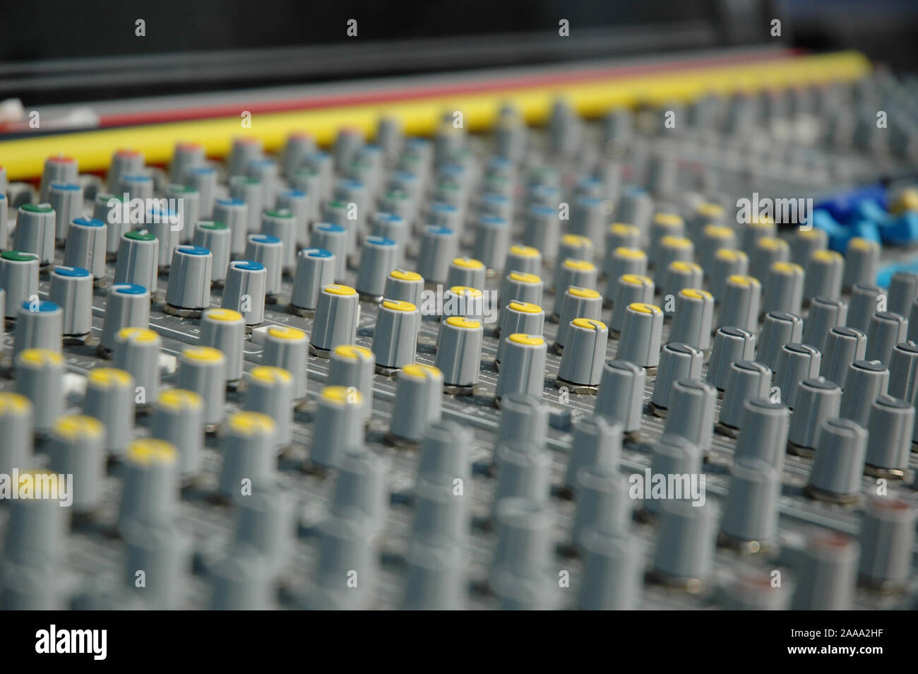 Audio mixing console in a recording studio. Faders and knobs of a sound ...