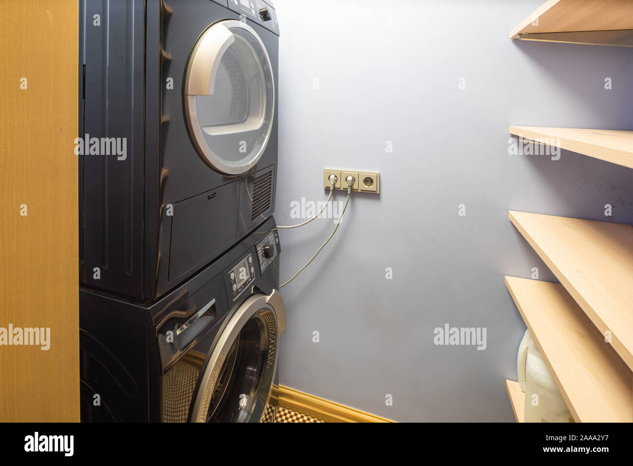 Home appliances. Washing machine. Wooden shelves Stock Photo - Alamy