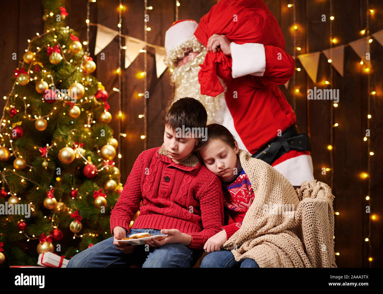 The children waited a long time for Santa, now they fell asleep and ...