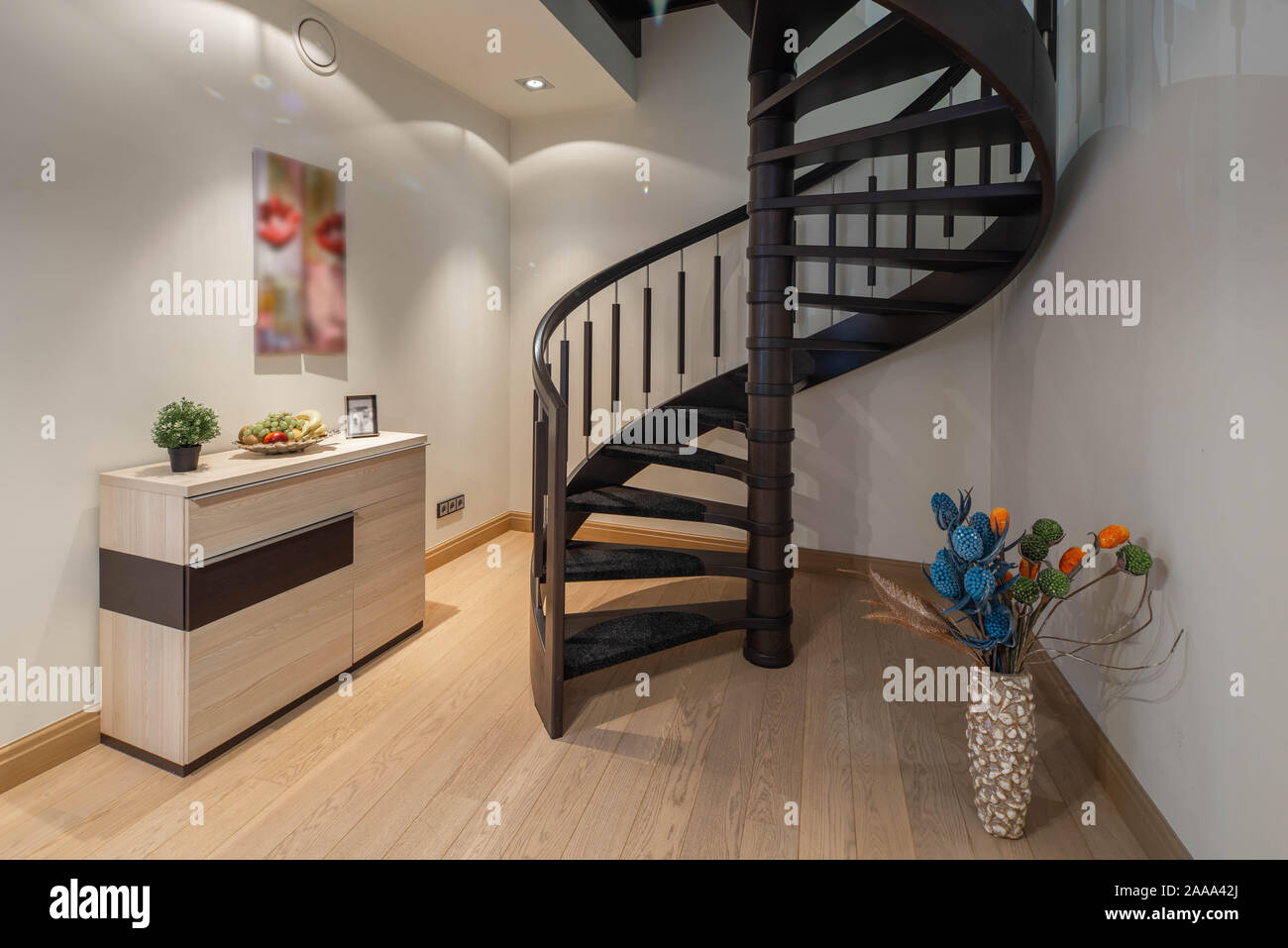 Modern interior of studio apartment. Stairs to the second floor. Wooden ...