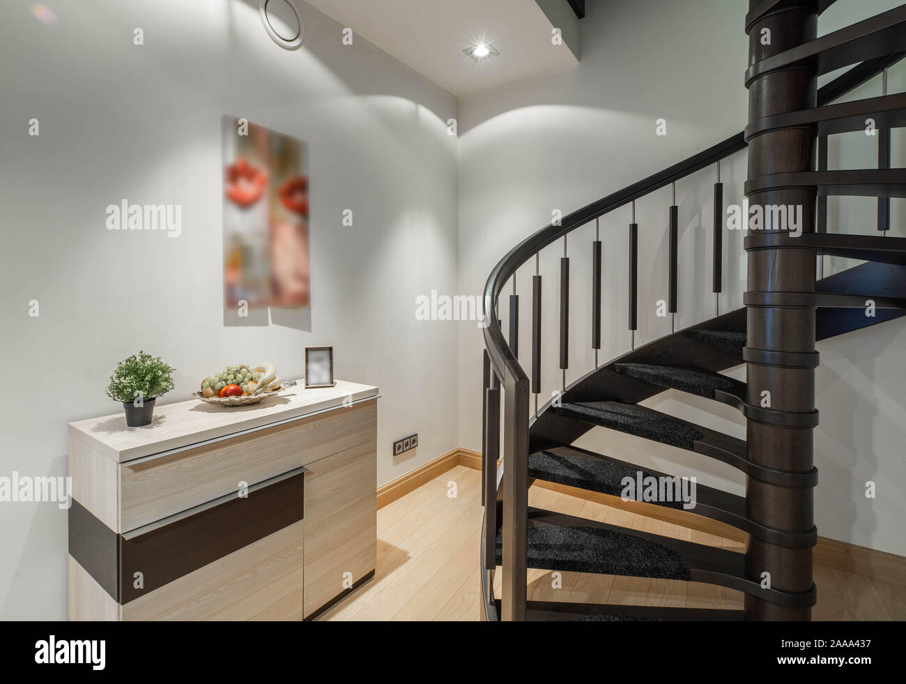 Modern interior of studio apartment. Stairs to the second floor. Wooden ...