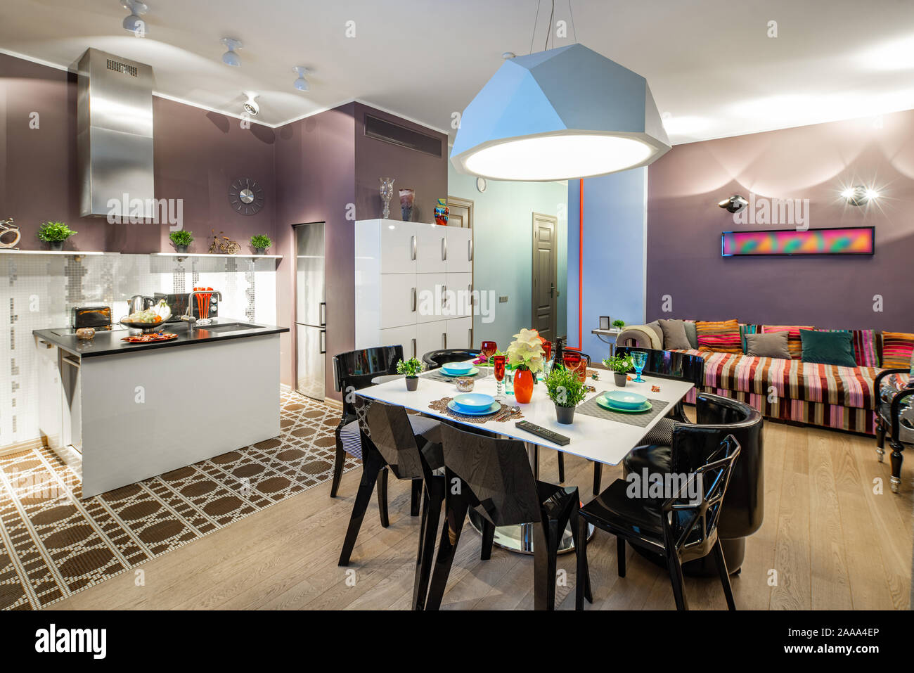Modern interior of studio apartment. Set table. Living room and kitchen ...