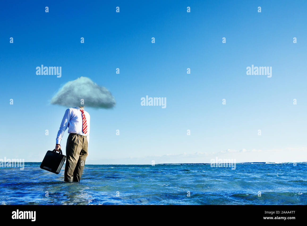 Challenge concept man suite, in sea, cloud head Stock Photo - Alamy