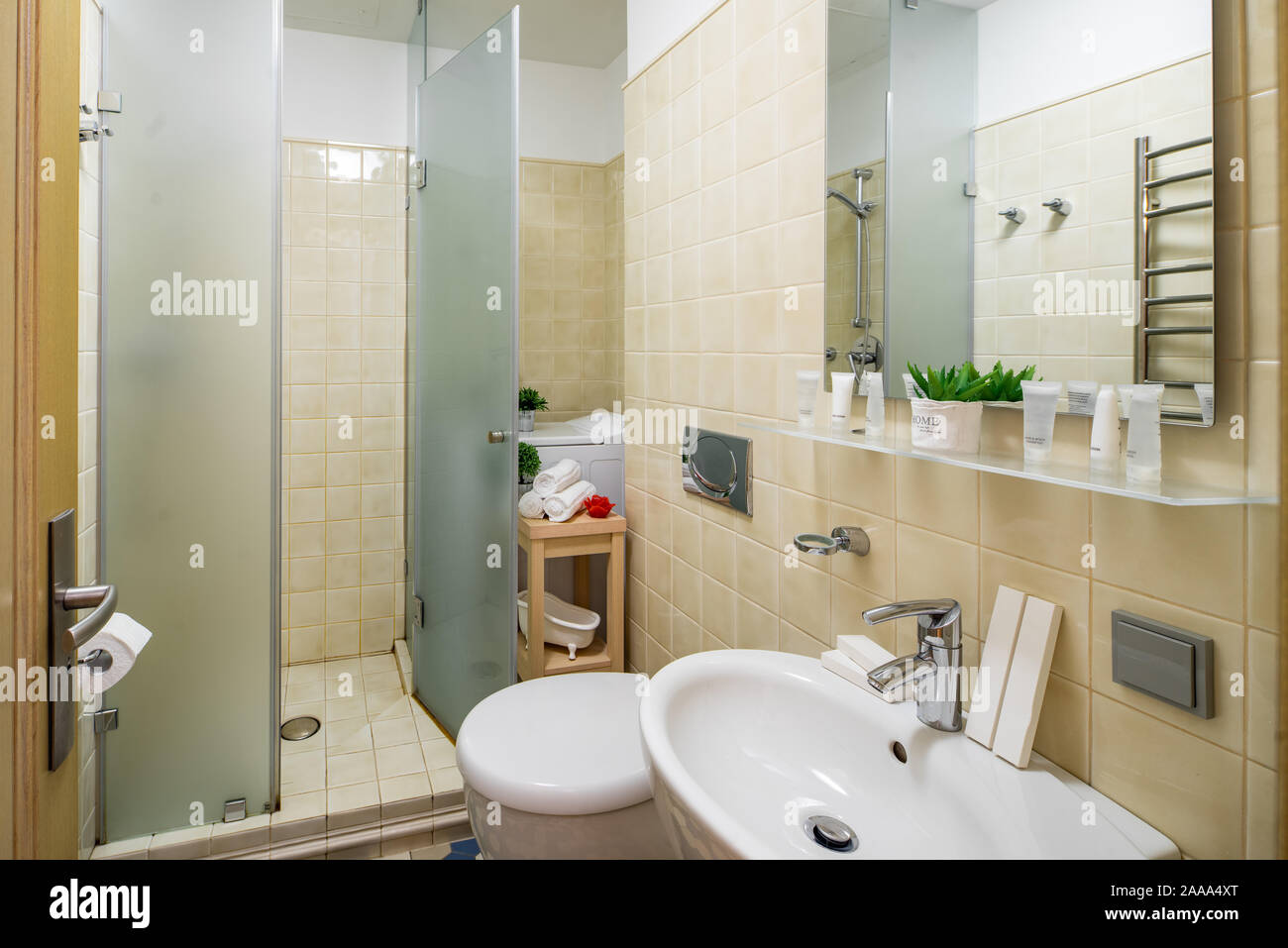 Bathroom with shower cabin. Tile floor and walls Stock Photo - Alamy