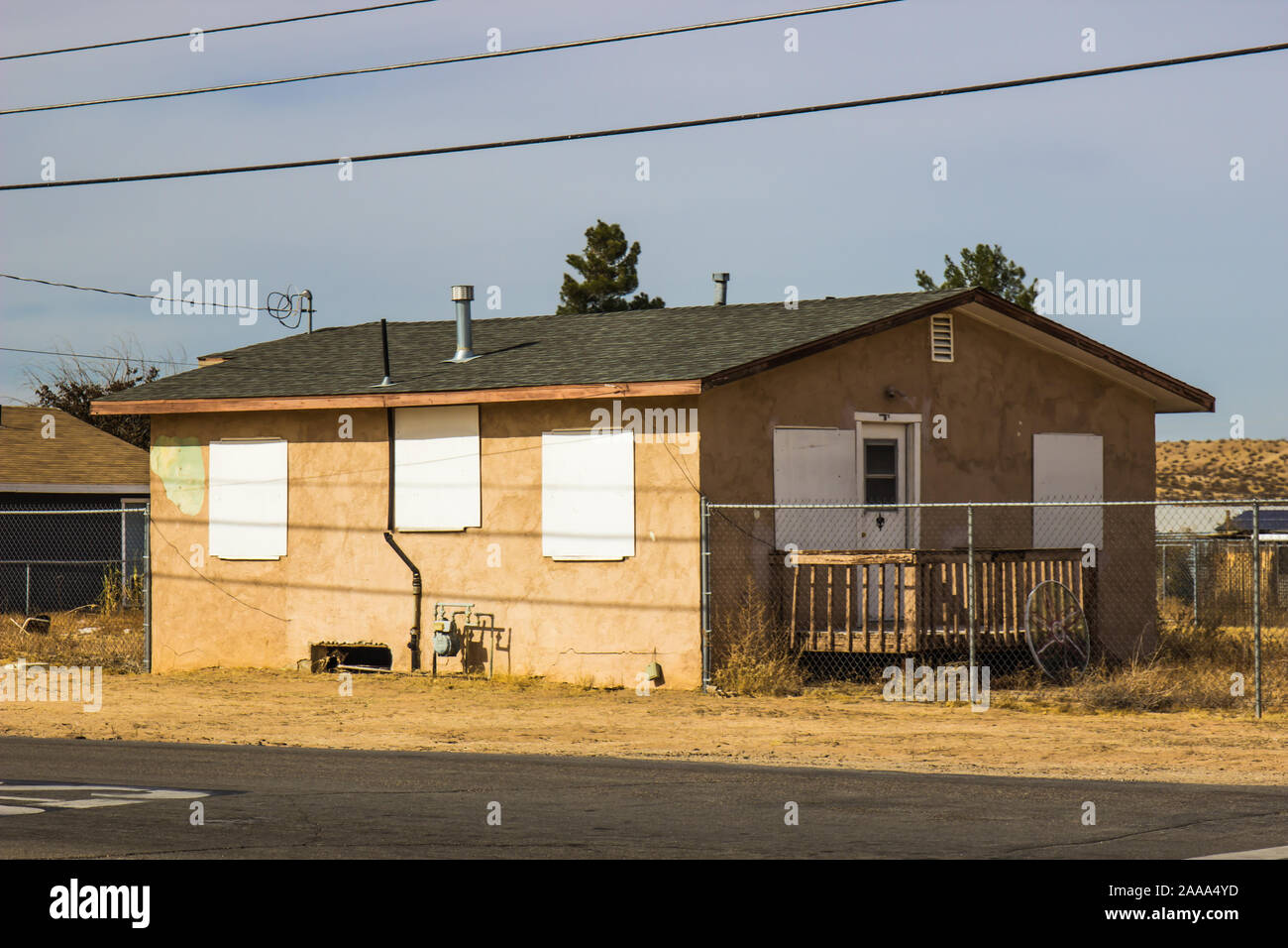 Abandoned One Story Home With Boarded Up Windows Stock Photo - Alamy