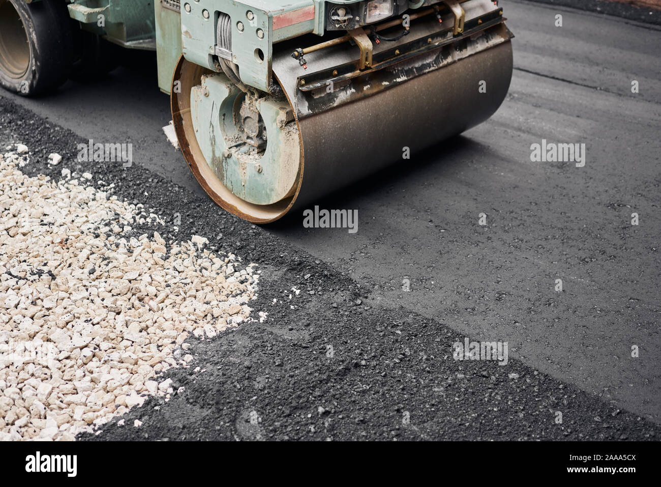 Asphalt Compactors is carrying out road repair work. Laying new asphalt ...
