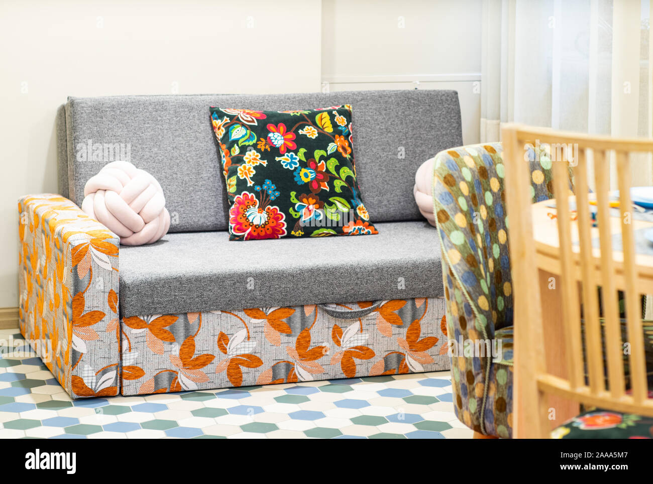 Soft grey sofa. Blurred foreground Stock Photo - Alamy