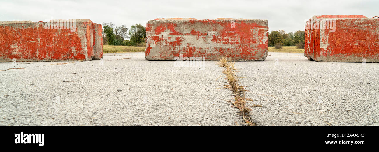Heavy concrete roadblocks blocking highway or street. Obstacle, dead ...
