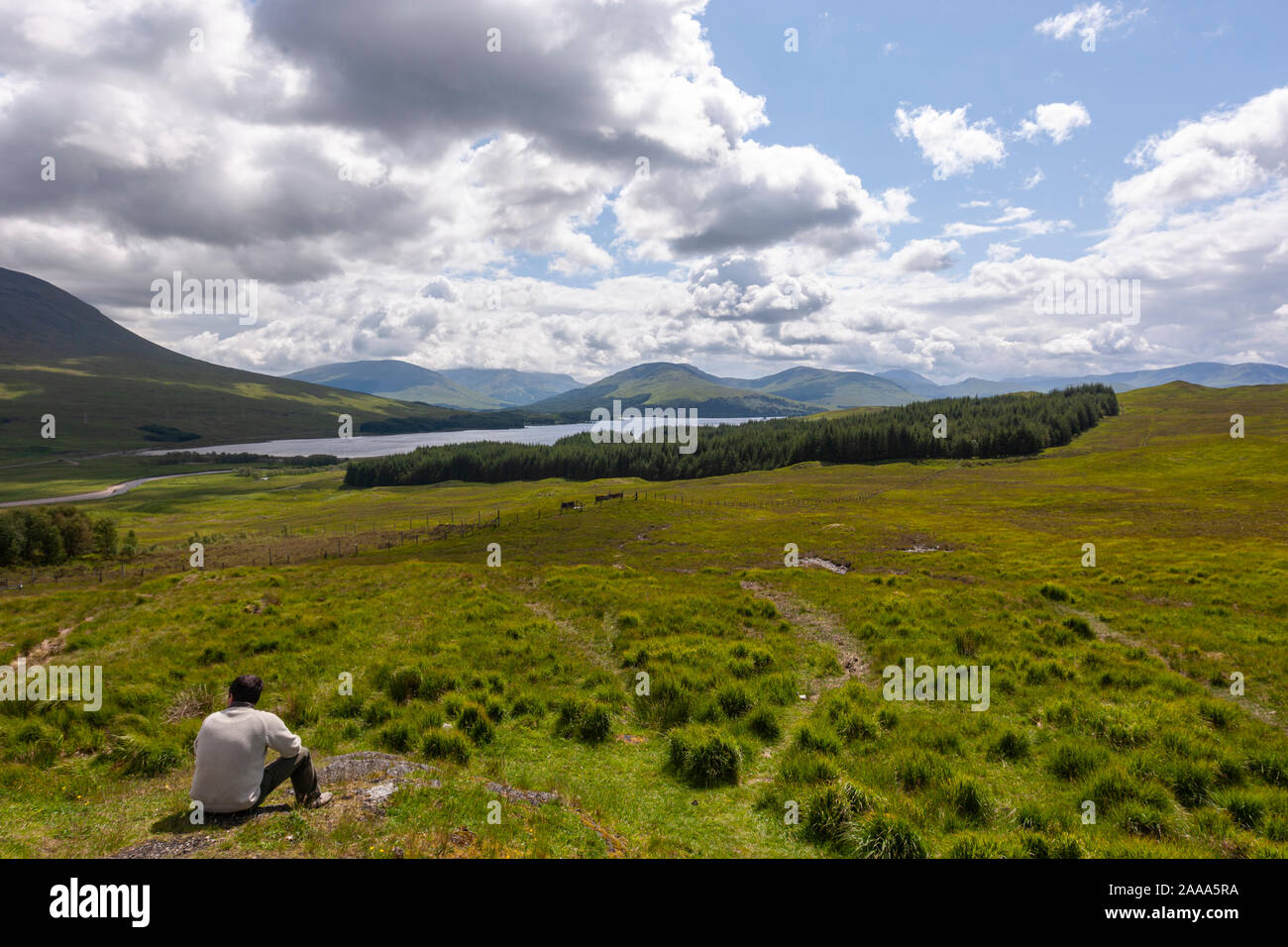 Tourist looking the landscape, Loch Tulla Viewpoint, Highland, Scotland ...