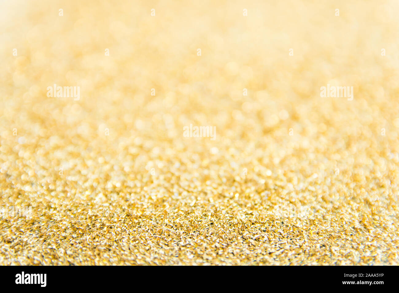Defocused gold glitter background. Gold abstract bokeh background ...