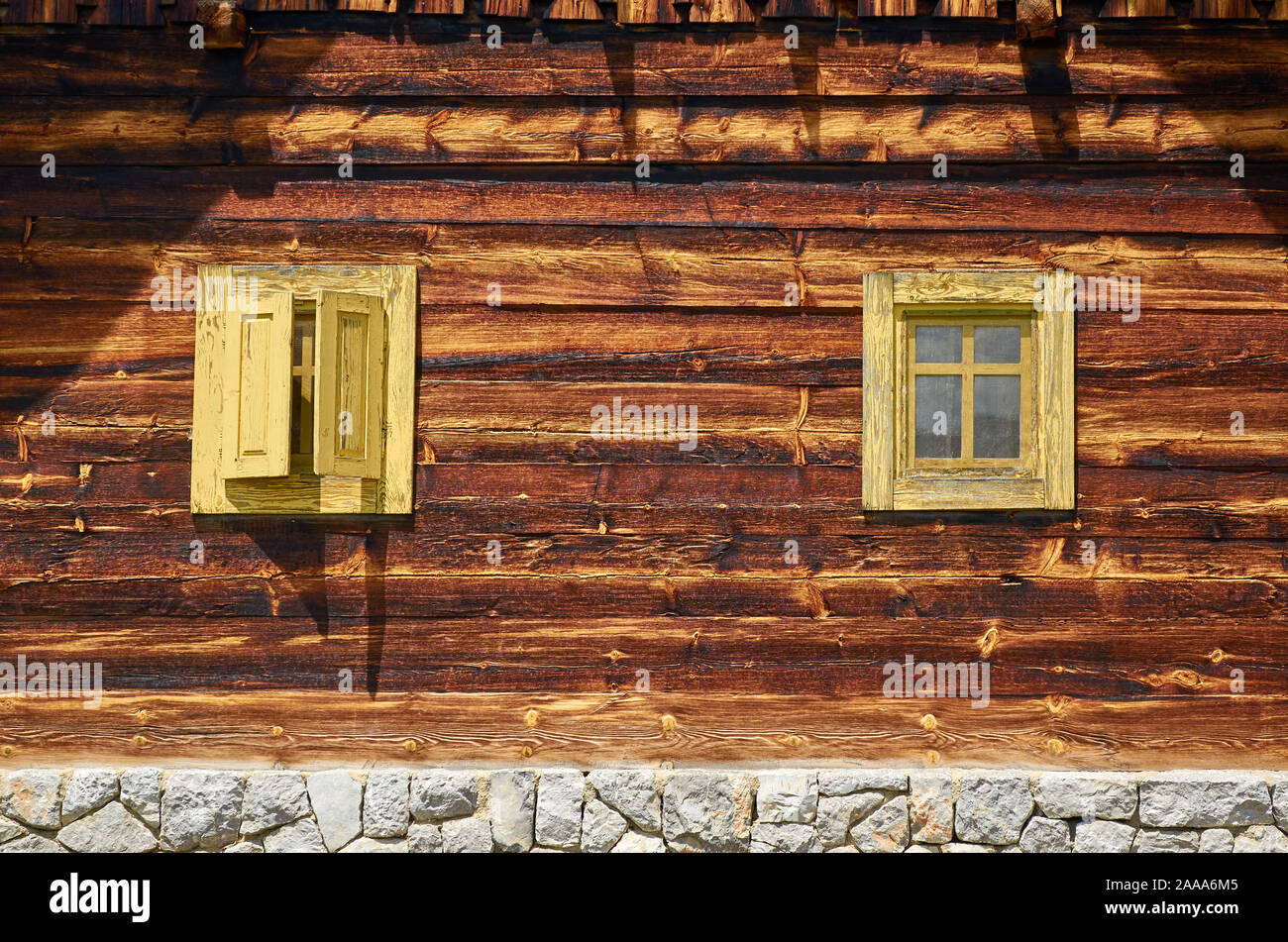 Windows of a wooden cottage in a traditional village style Stock Photo ...