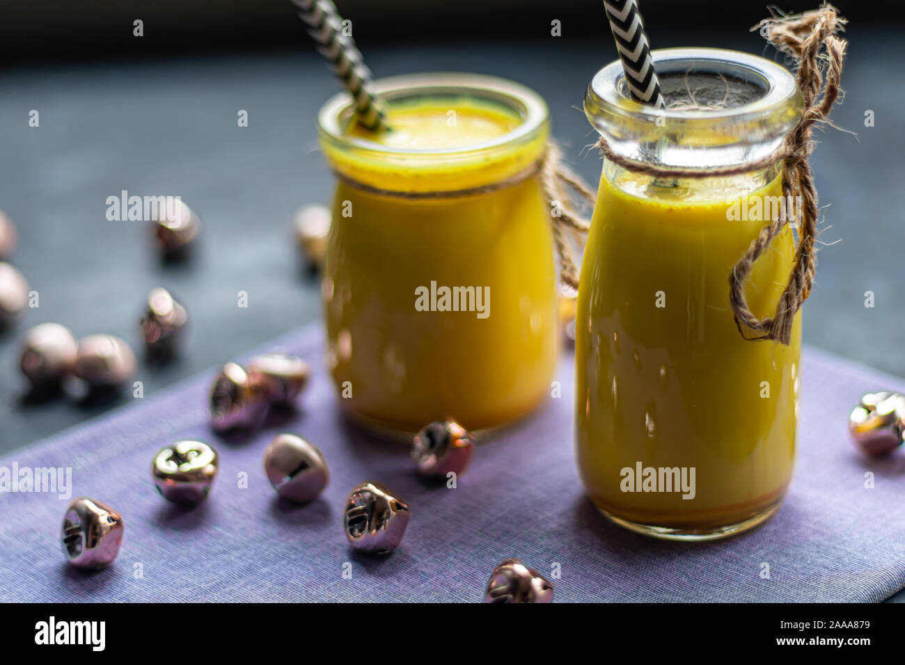 Golden milk with spices. Turmeric, cloves, black pepper and a drop of ...