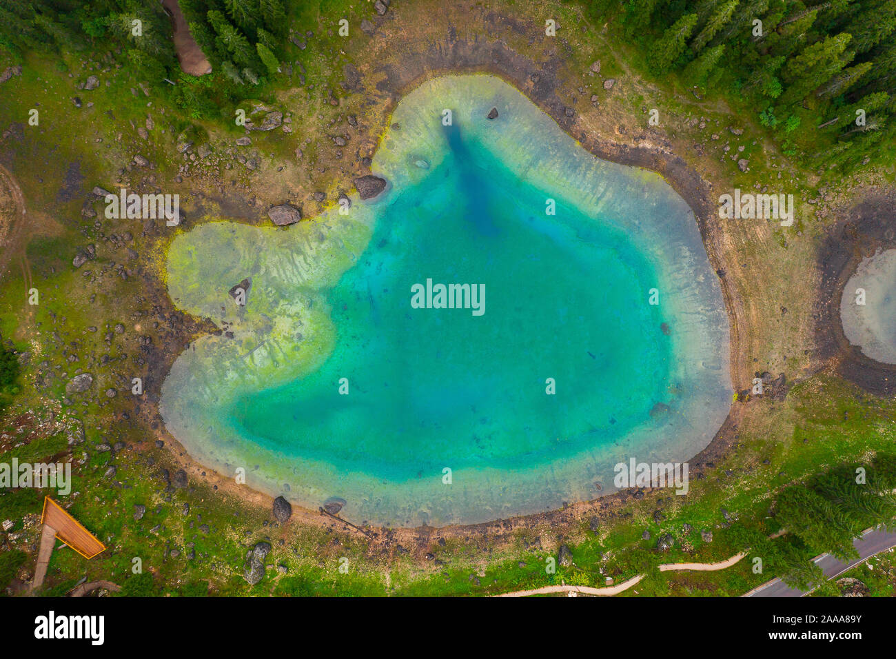 Aerial view of turquoise blue water of lake Carezza in Alps Dolomites ...