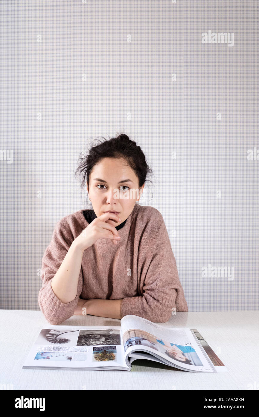 Young woman reading magazine released Stock Photo - Alamy