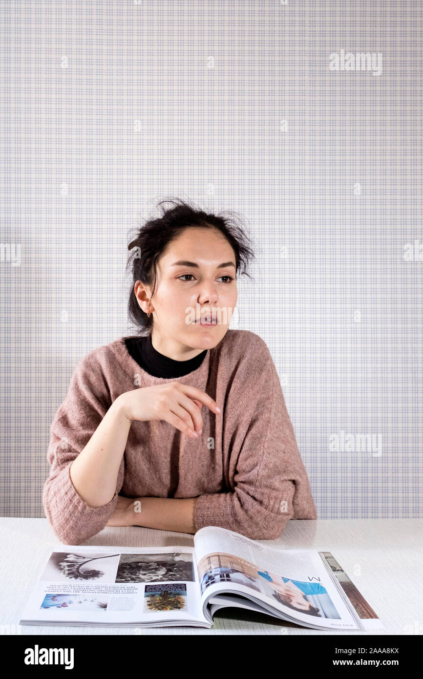 Young woman reading magazine released Stock Photo - Alamy