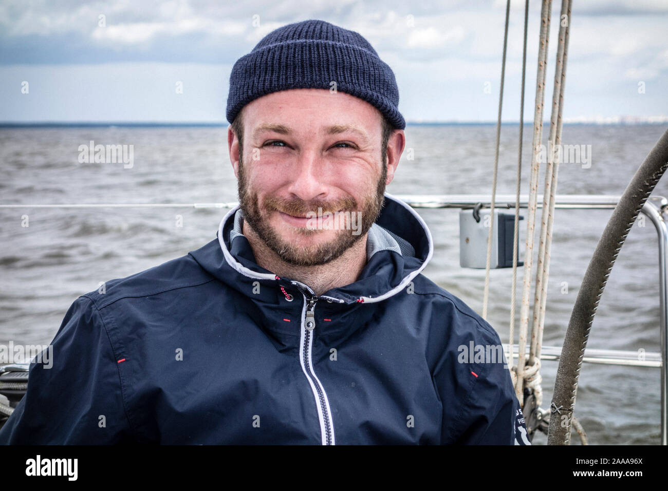 Sailor on a yacht smiling Stock Photo - Alamy