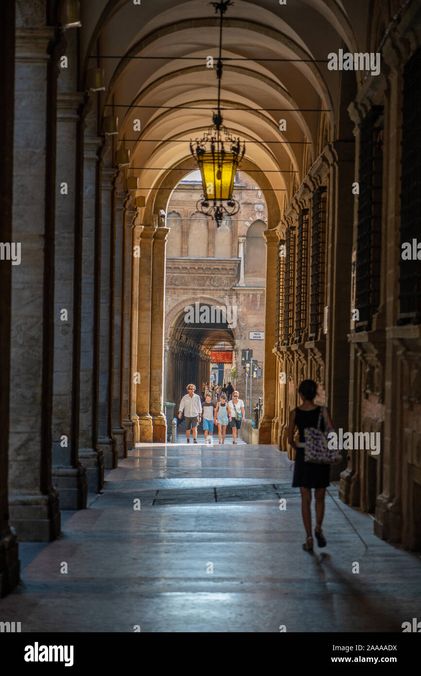Bologna, Italy - August 8, 2019: Peple walk in portico passage with ...