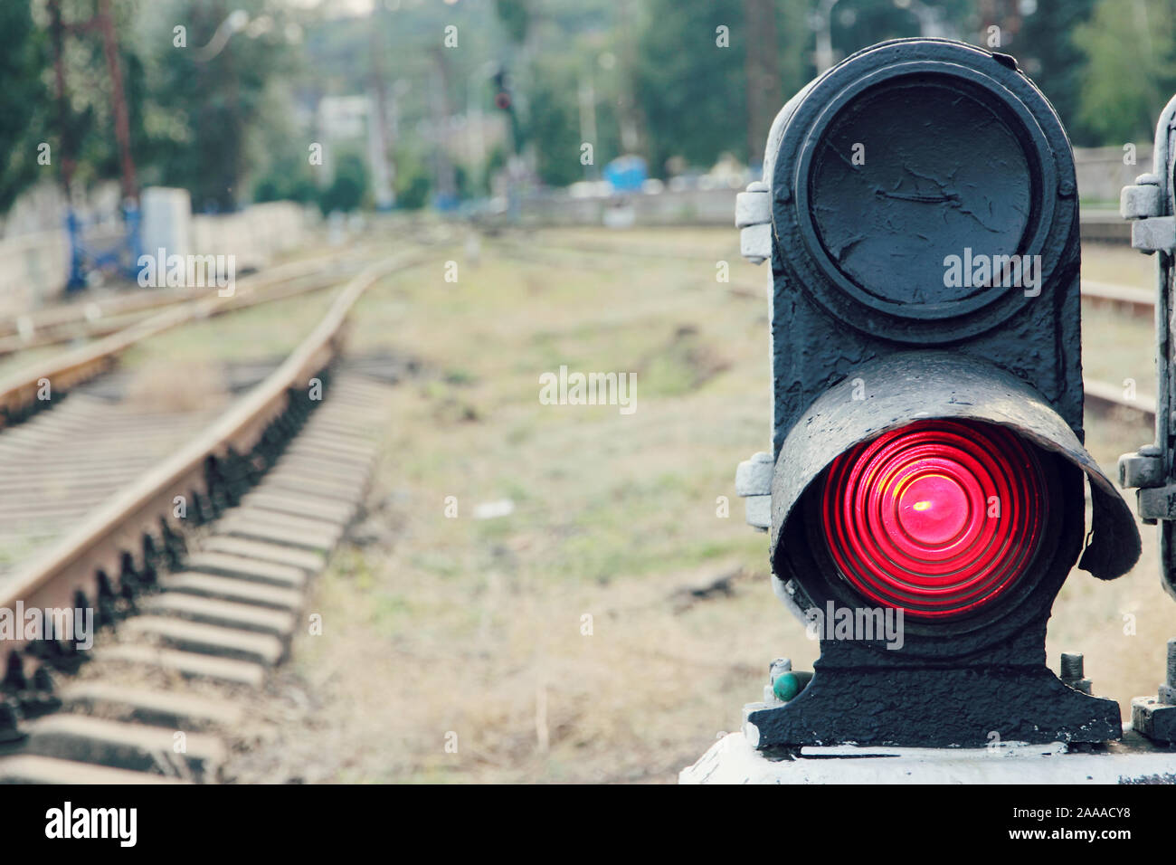 Stop sign at a red traffic light at a railway station Stock Photo - Alamy