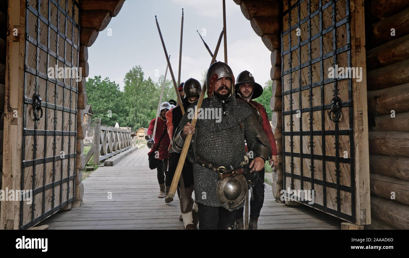 A group of medieval knights come back from the battle. Military ...