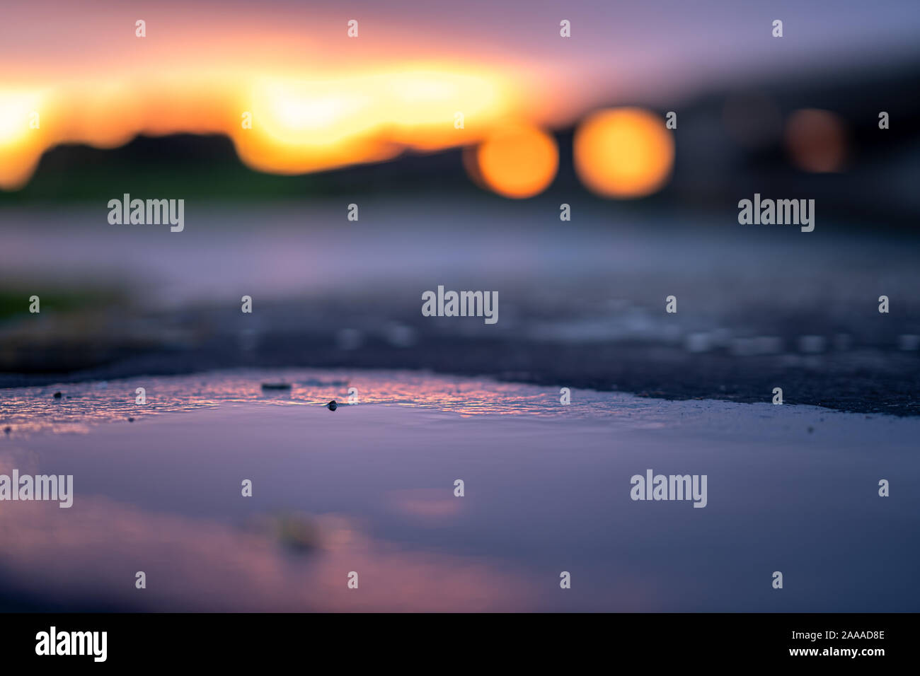 Puddle sun reflection pavement hi-res stock photography and images - Alamy
