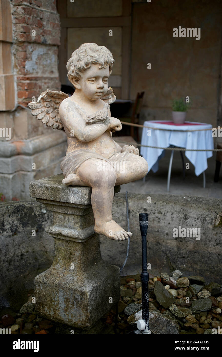 statue of an angel in the castle fountain Stock Photo - Alamy
