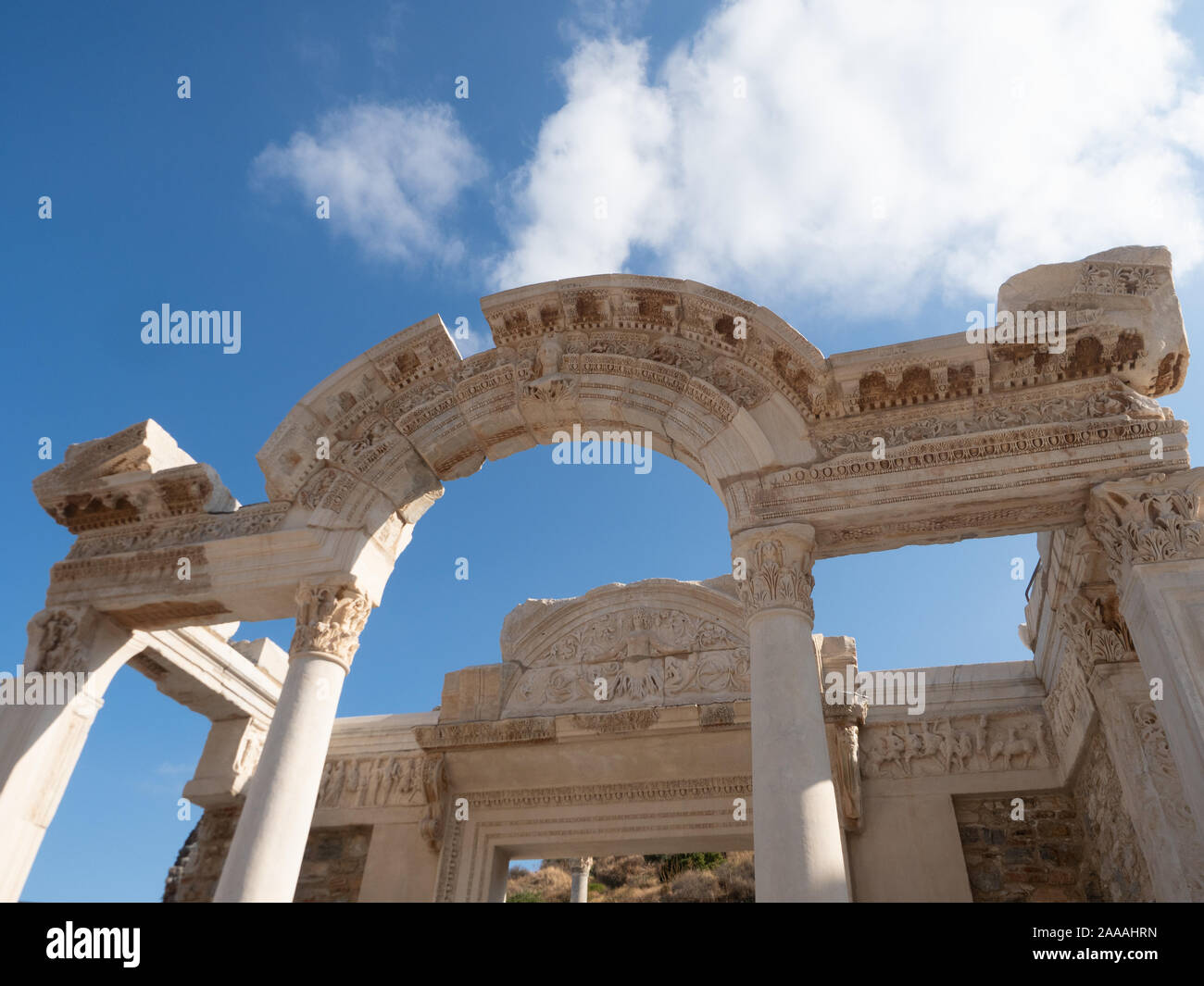 The carved stone arch and frieze with a sculpture of Medusa on the ...