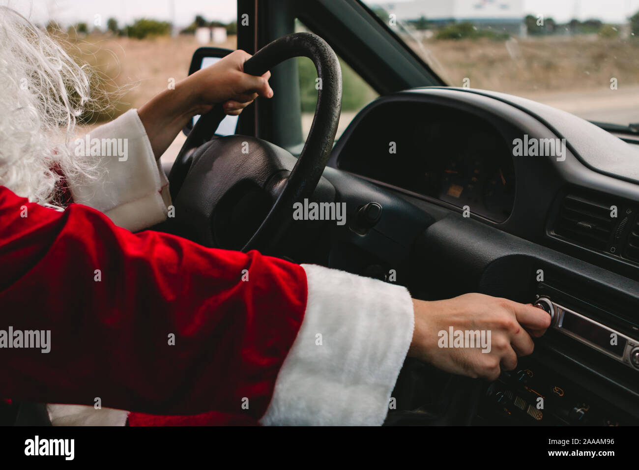 Santa Claus working as a delivery man while listing music Stock Photo ...