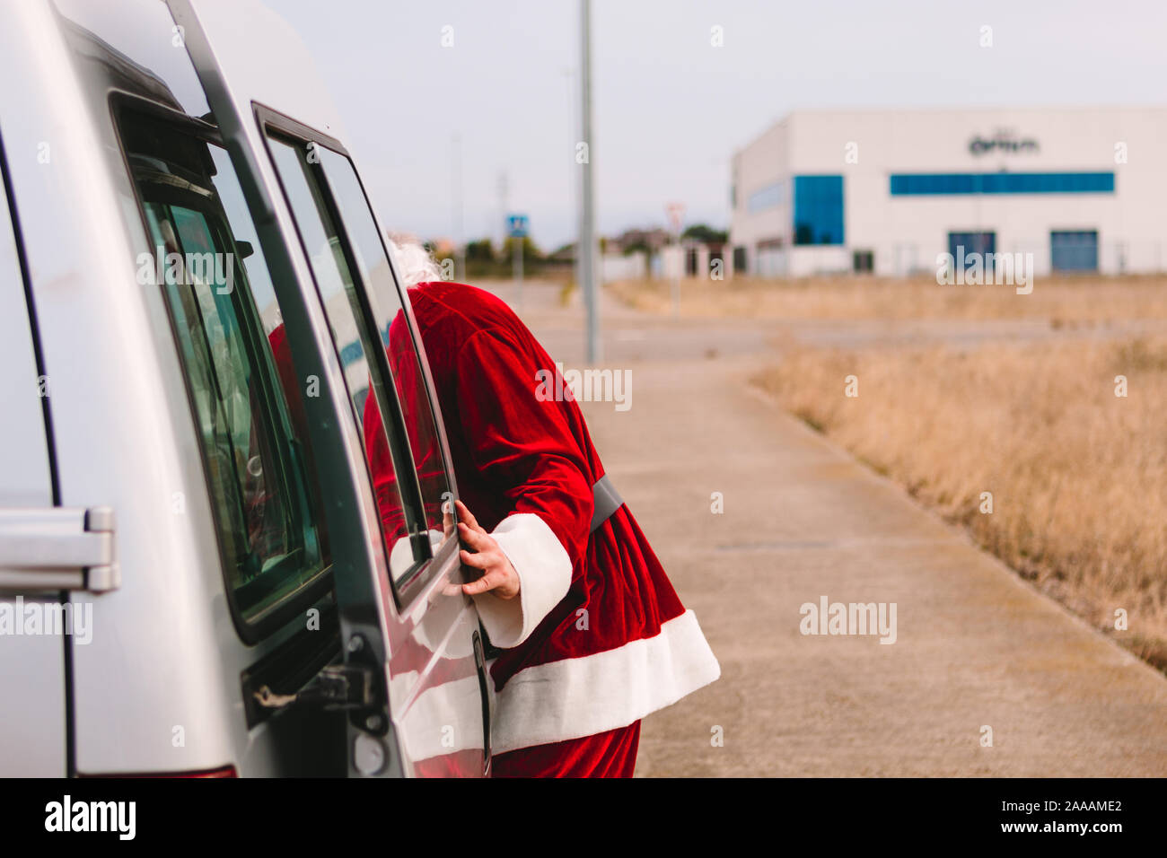 Santa Claus working as a delivery man Stock Photo - Alamy
