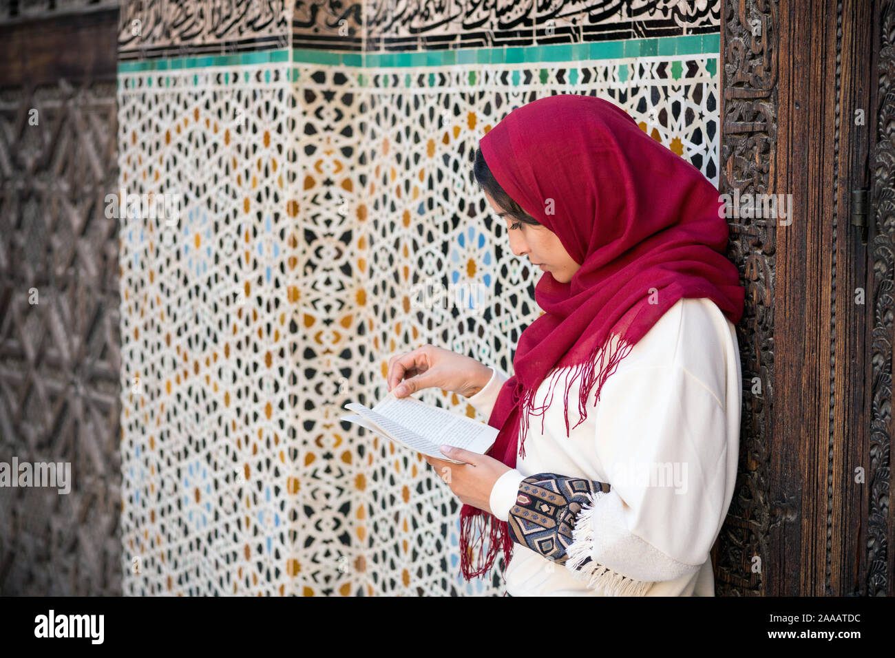 Young muslim woman reading a book Stock Photo - Alamy