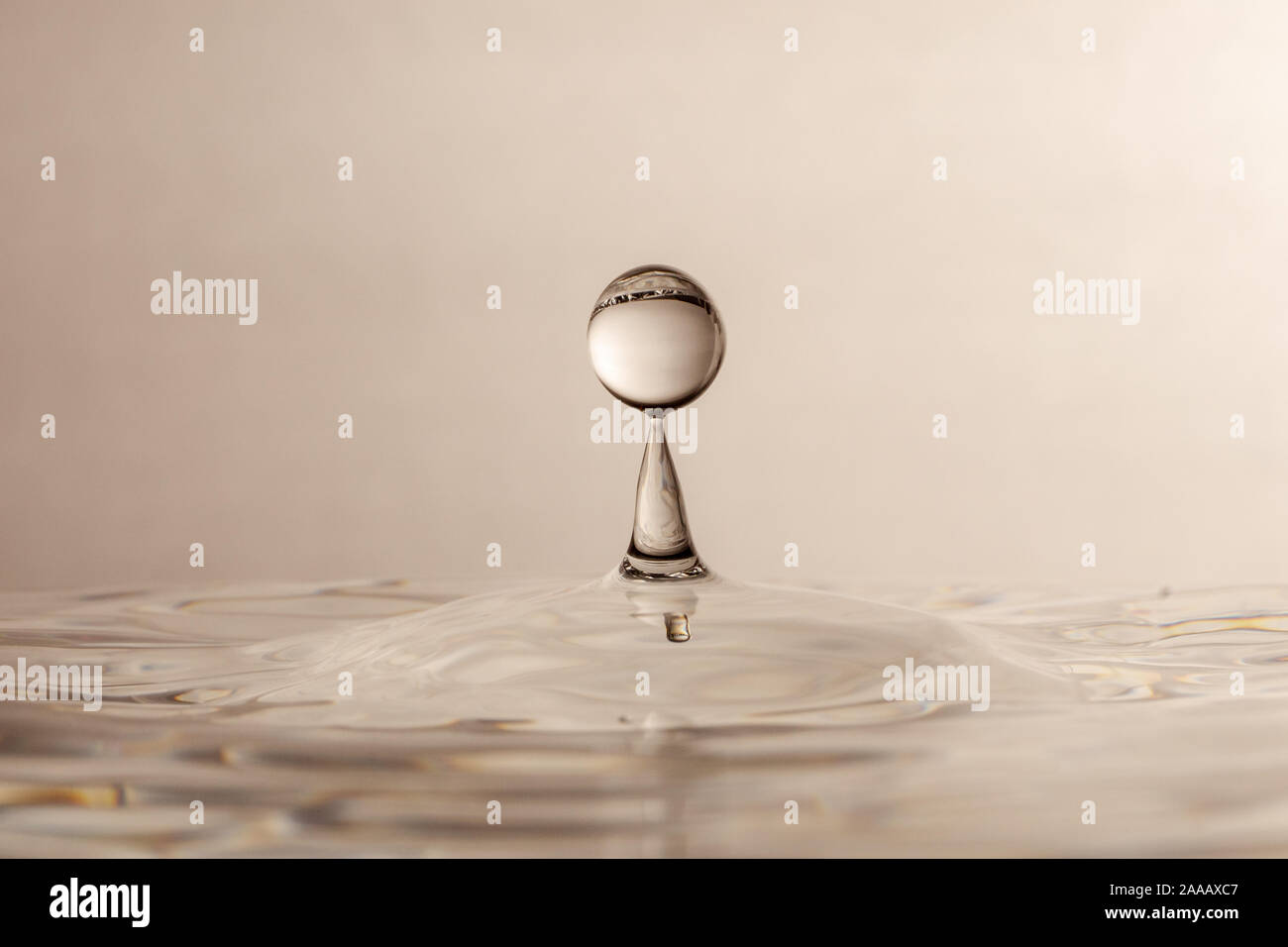 Water drops collision in sephia Stock Photo - Alamy