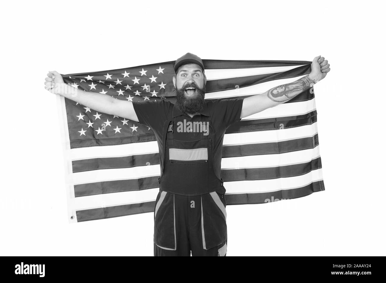 USA flag is flown higher than the others. Bearded man holding american ...